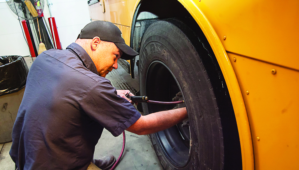 Garage staff makes ure the wheels keep going ’round and ’round ...