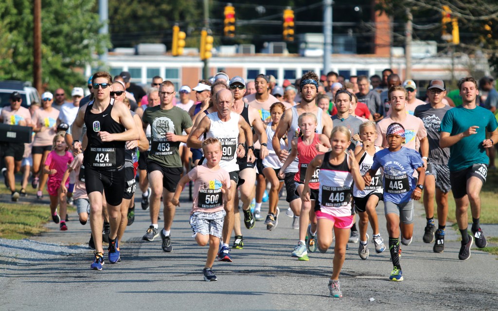 A race for a special cause... Over 100 runners take to the road in Race ...