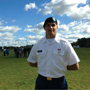 Carrying two military banners… Carr serving in U.S. Army while also ...