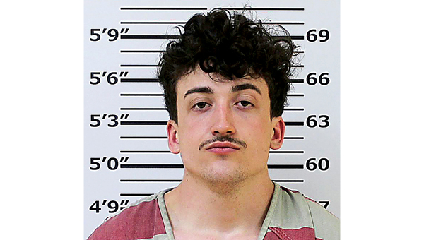 Man charged in connection with vehicle stolen at gunpoint ...